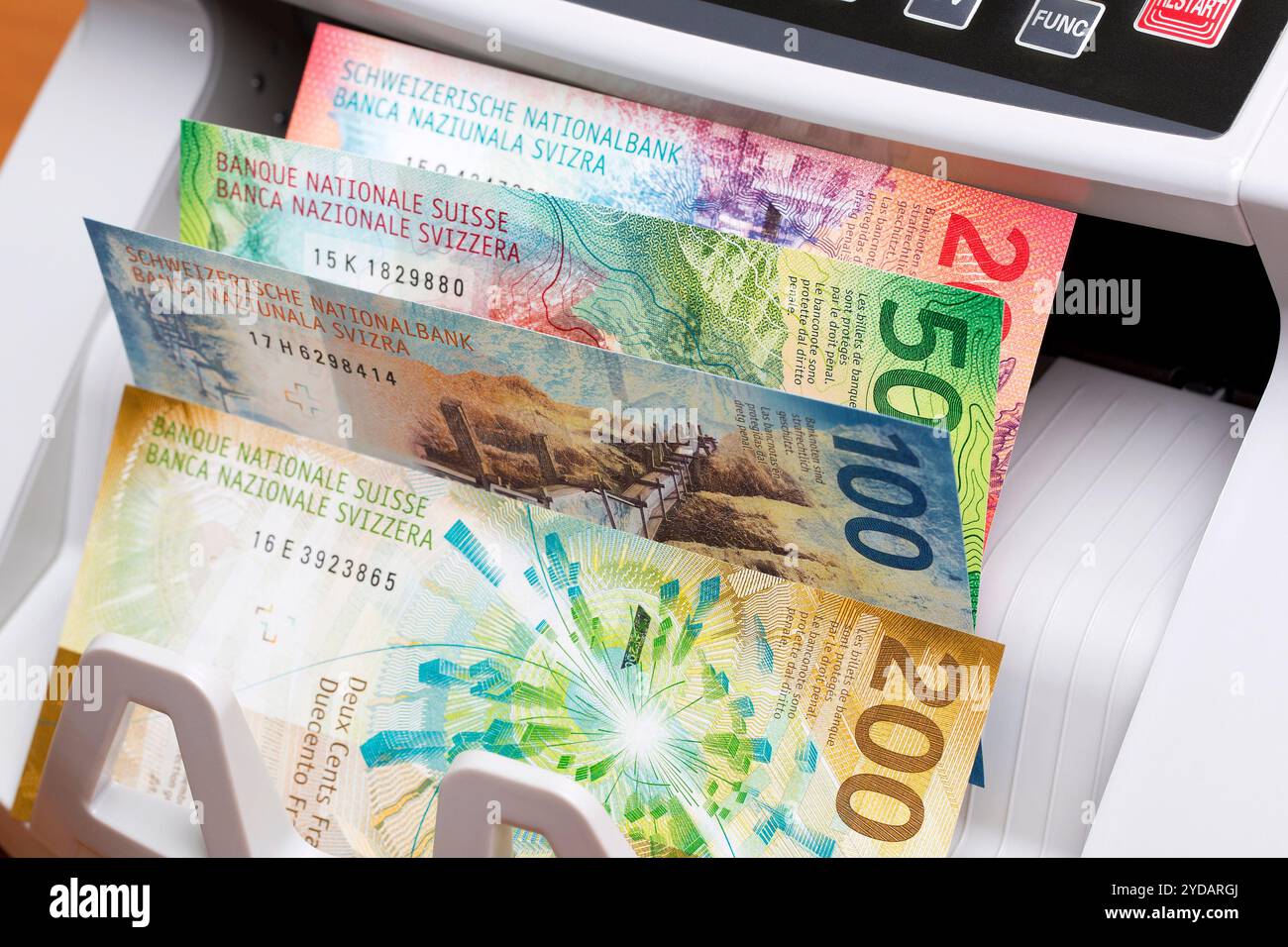 Swiss Franc in the counting machine Stock Photo - Alamy
