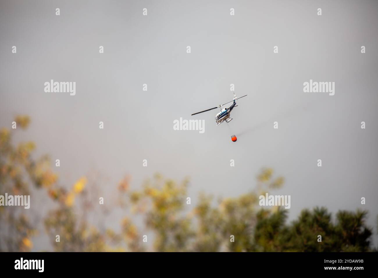 Aerial Helicopter Fighting Forest Fire with Water Bucket Stock Photo ...
