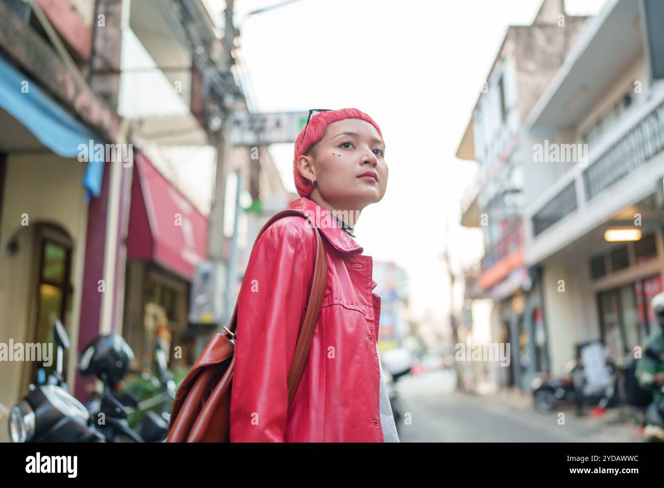 Gen z girl leather fashion with punk Asian woman tourist of local city ...