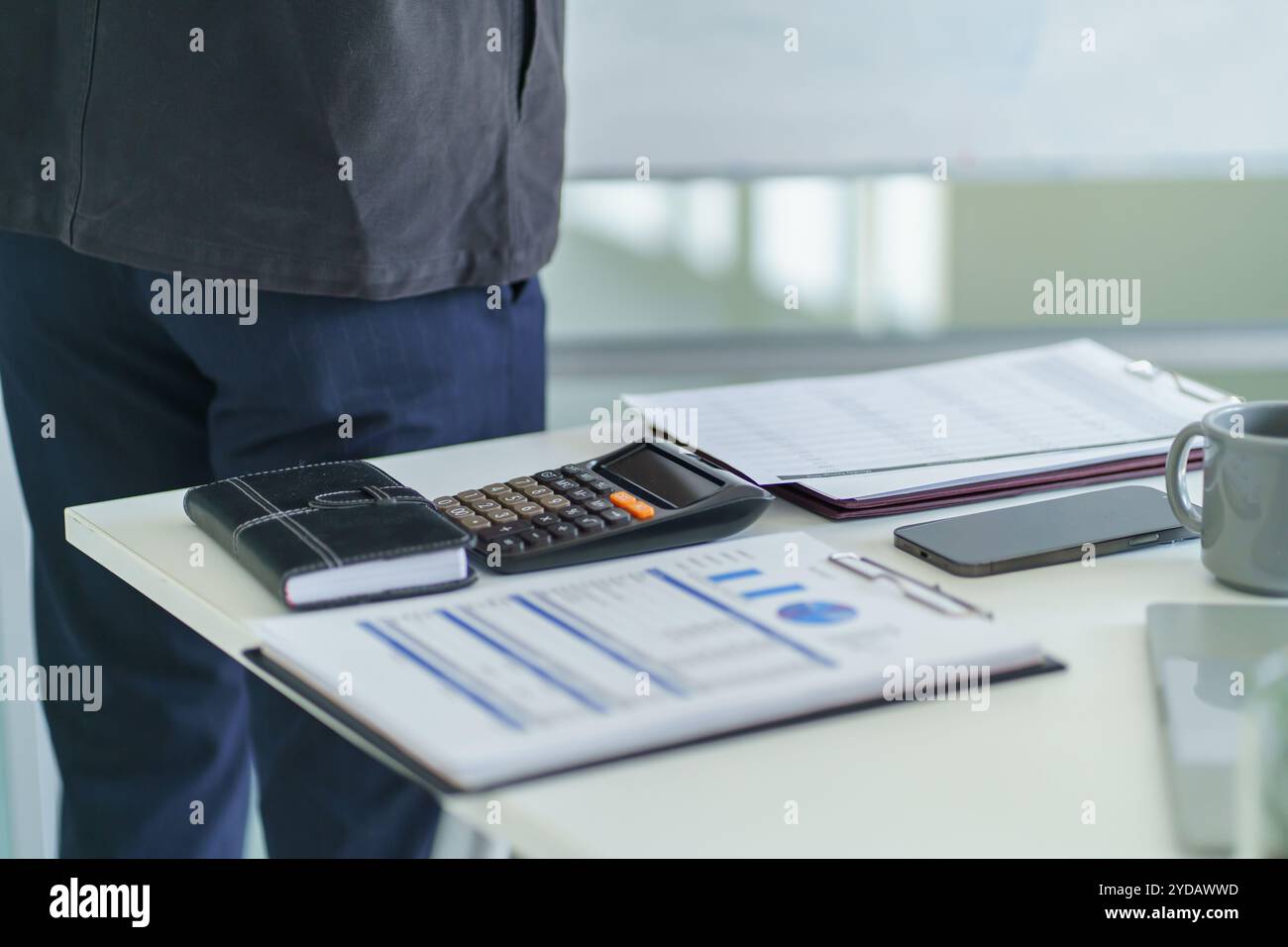 Young business man busy standing work at office. businessman using ...