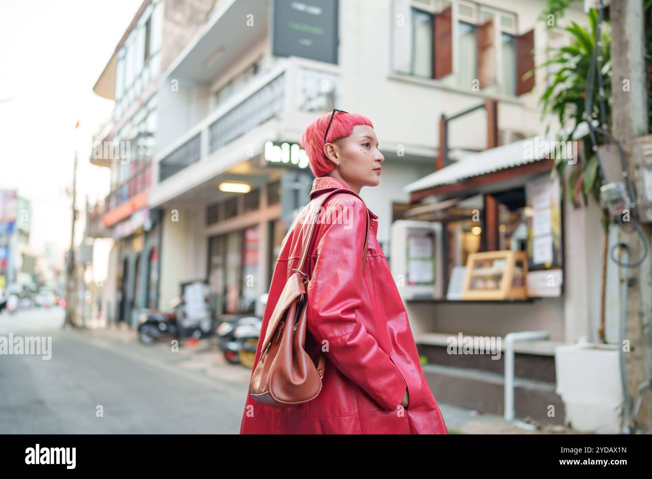 Gen z girl leather fashion with punk Asian woman tourist of local city ...