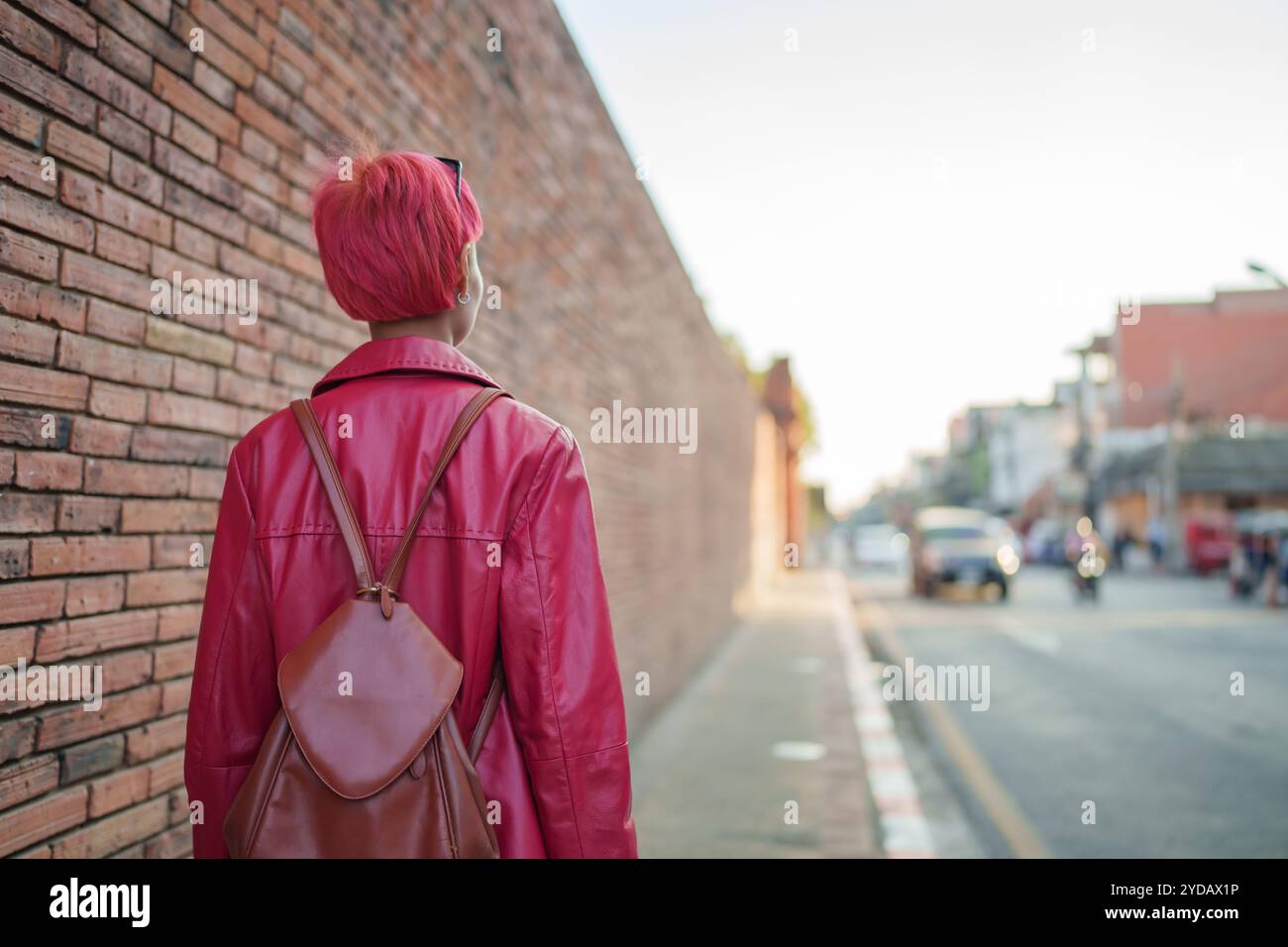 Gen z girl leather fashion with punk Asian woman tourist of local city ...