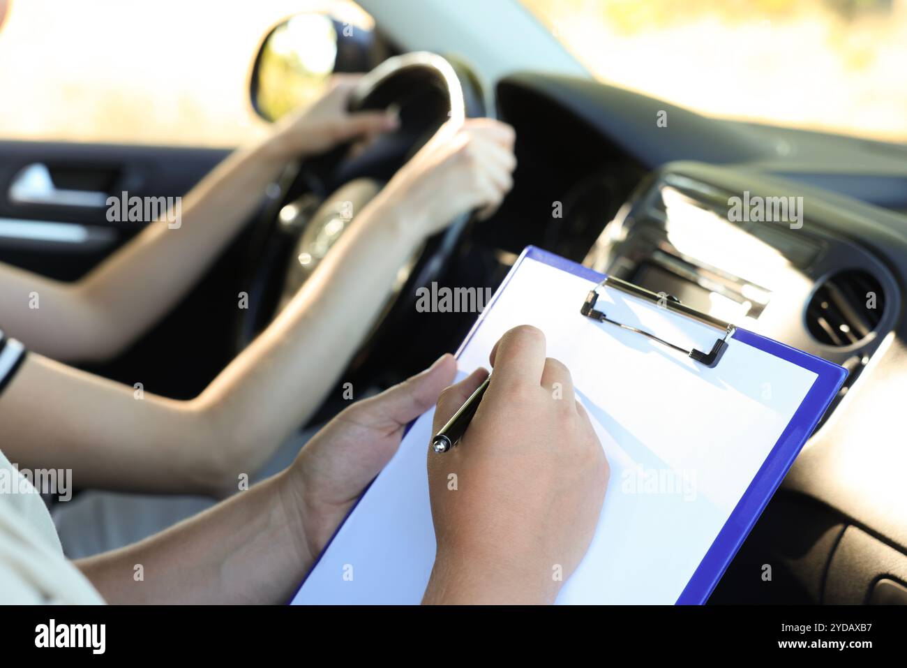 Driving school. Student passing driving test with examiner in car ...