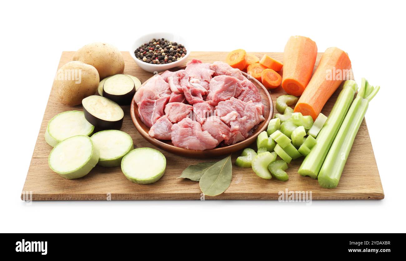 Cooking stew. Uncooked meat and vegetables isolated on white Stock ...