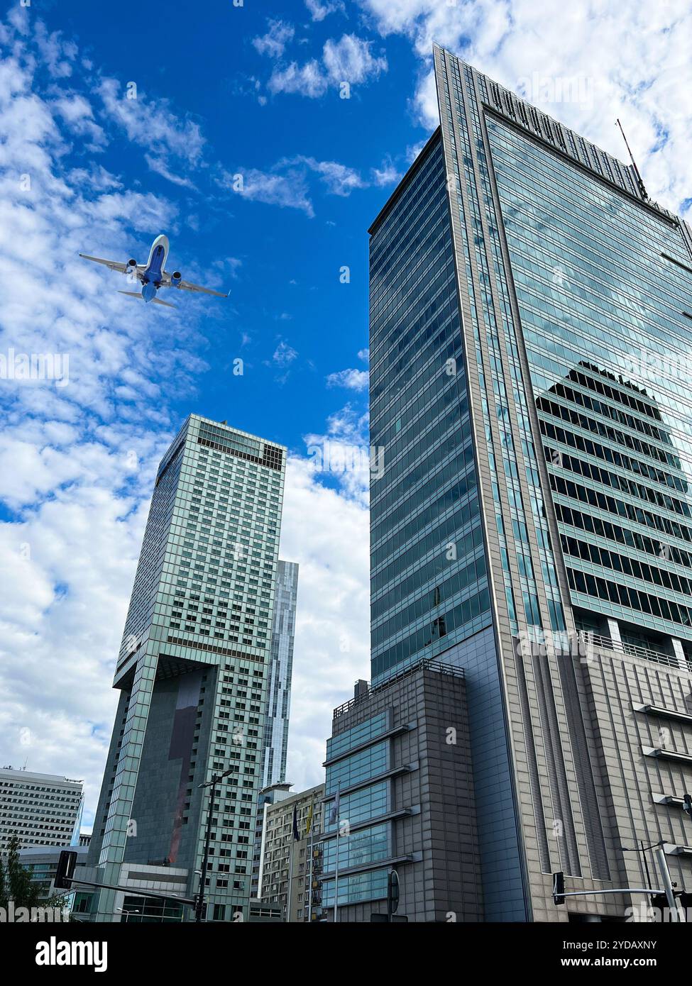 Airplane flying over high buildings hi-res stock photography and images ...