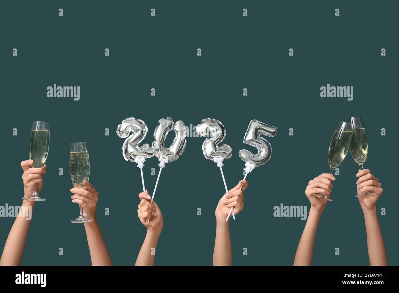 Female hands with glasses of champagne and figure 2024 made of balloons ...