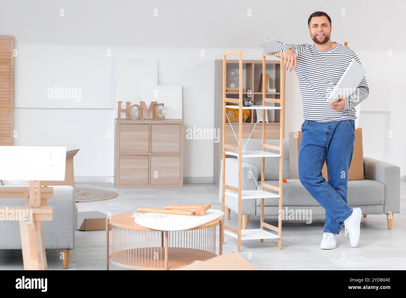 Man assembling new wooden shelf hi-res stock photography and images - Alamy