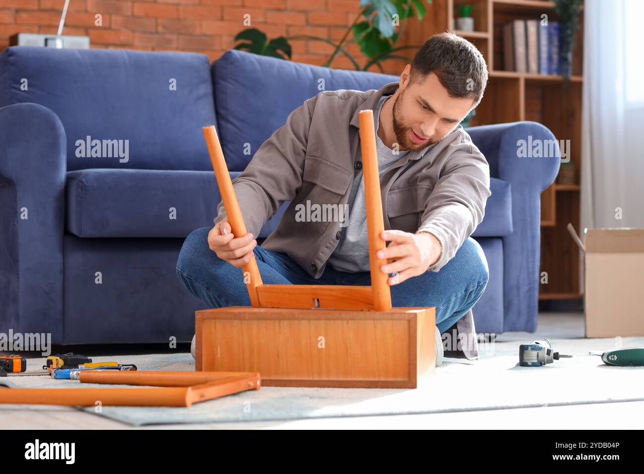 Caucasian man assembling table hi-res stock photography and images - Alamy