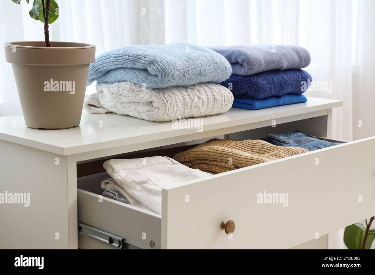 Open drawer with clean clothes at home, closeup Stock Photo - Alamy