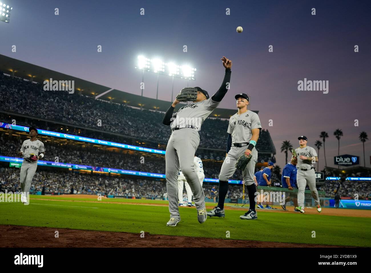 New York Yankees right fielder Juan Soto tosses a ball to a fan after ...
