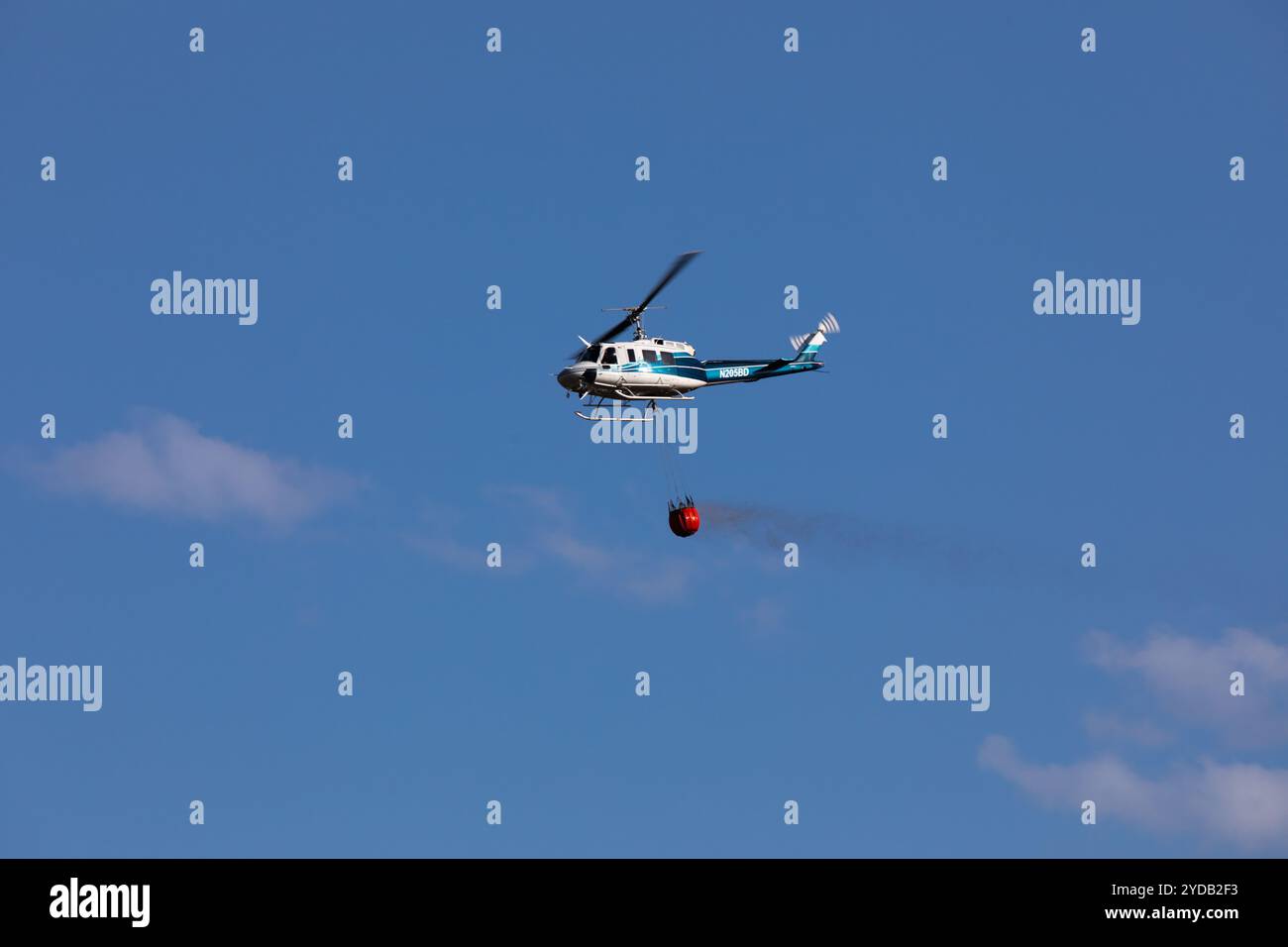 Helicopter Engaged in Aerial Firefighting with Water Bucket Stock Photo ...