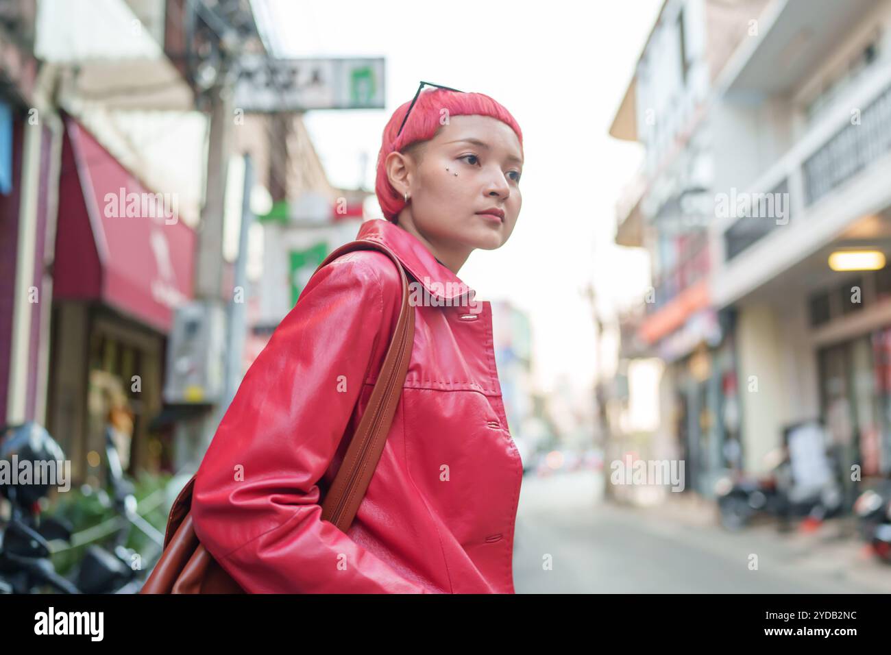 Gen z girl leather fashion with punk Asian woman tourist of local city ...