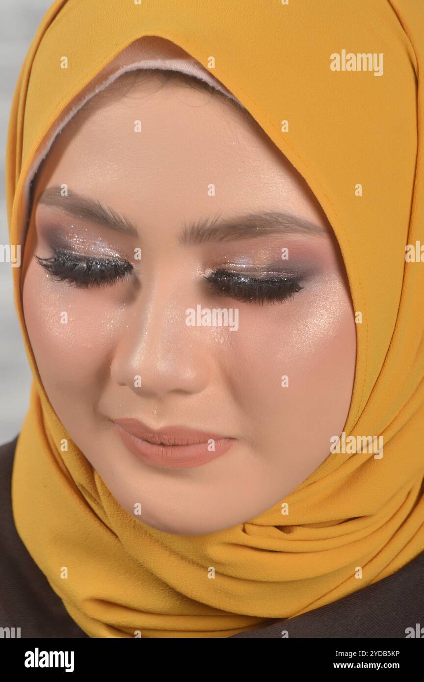 Portrait Beautiful Muslim Asian Girls wearing brown Muslim clothes and ...