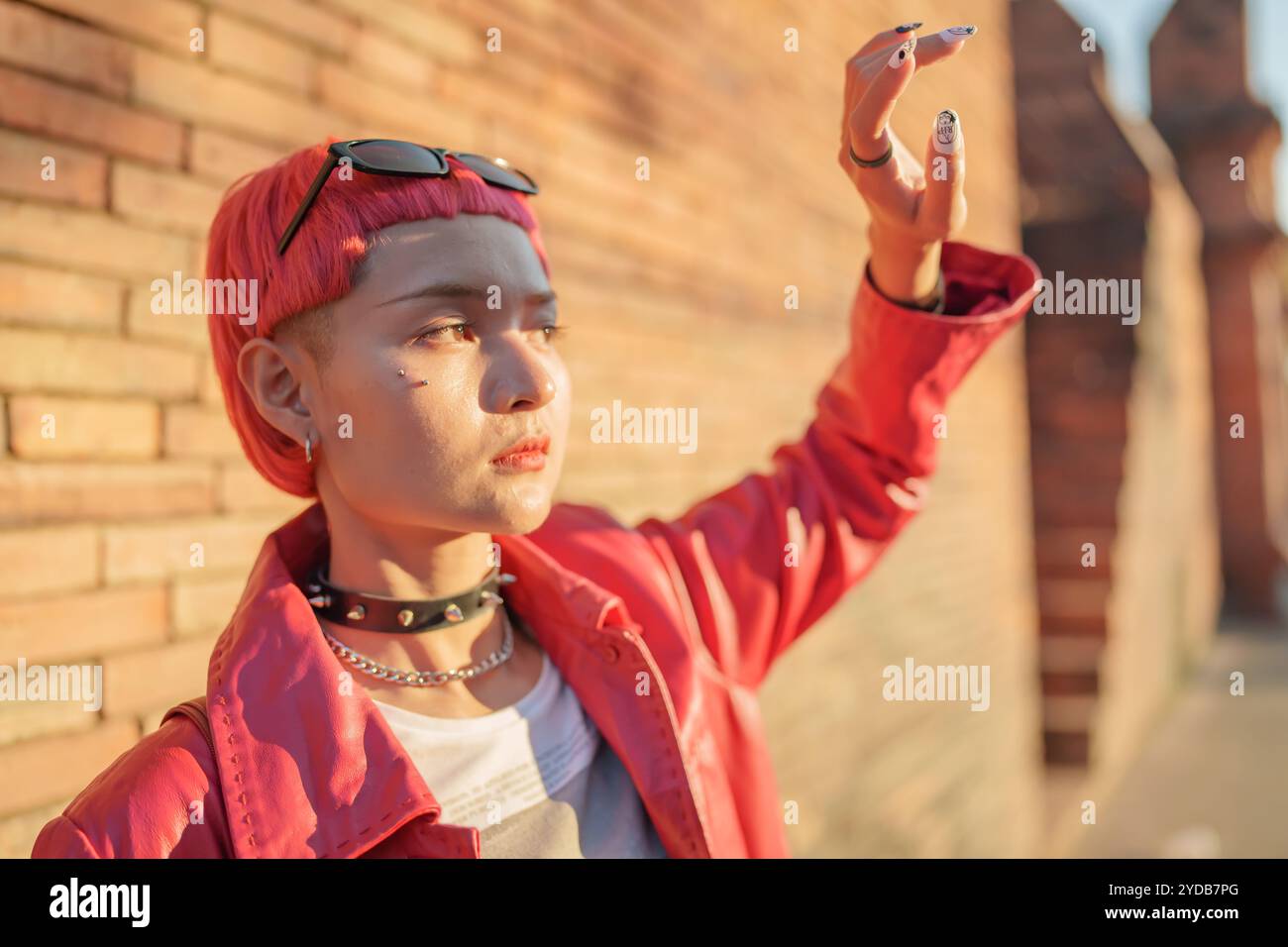 Gen z girl leather fashion with punk Asian woman tourist of local city ...