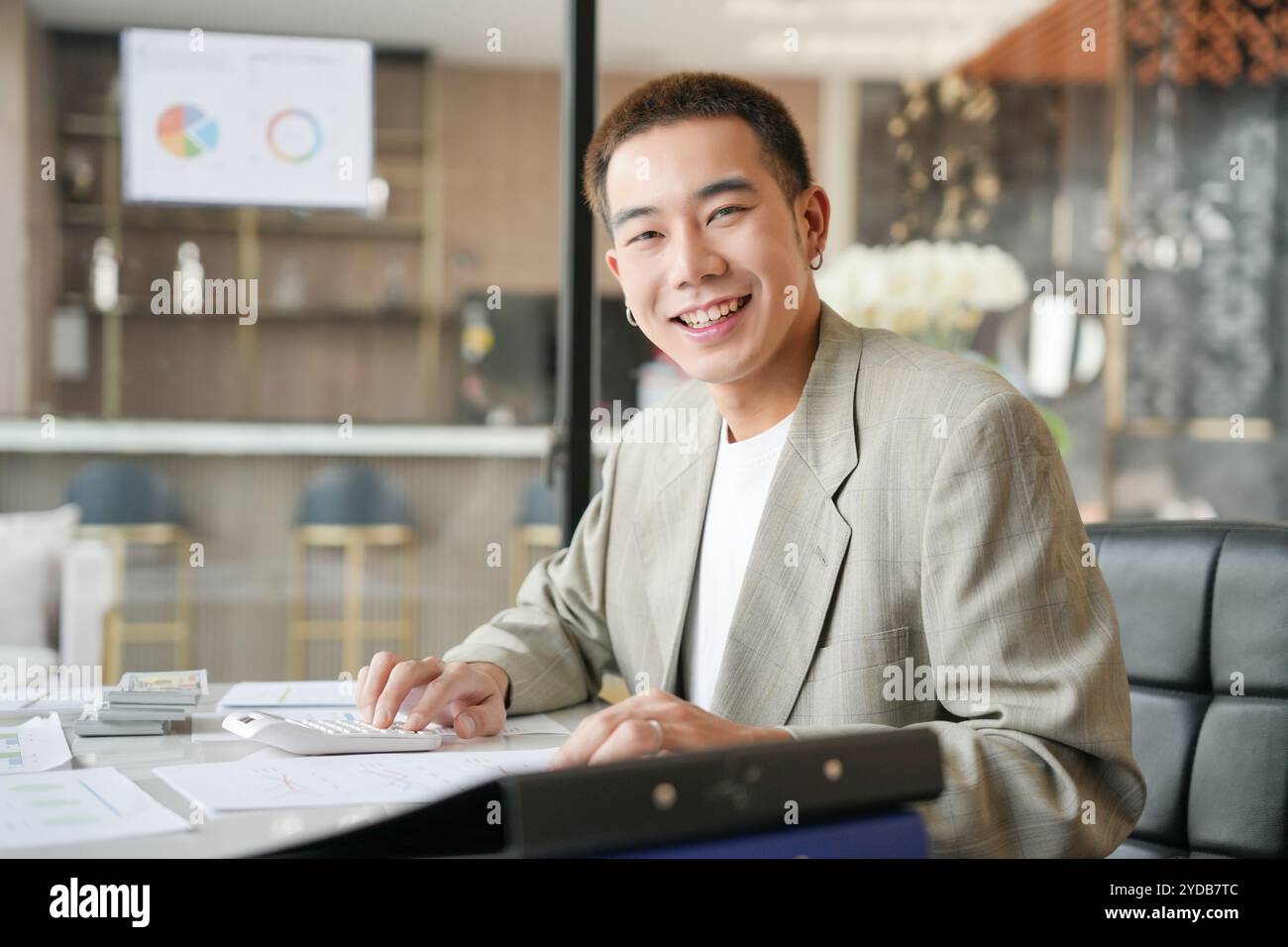 Asian man in office smiling hi-res stock photography and images - Alamy