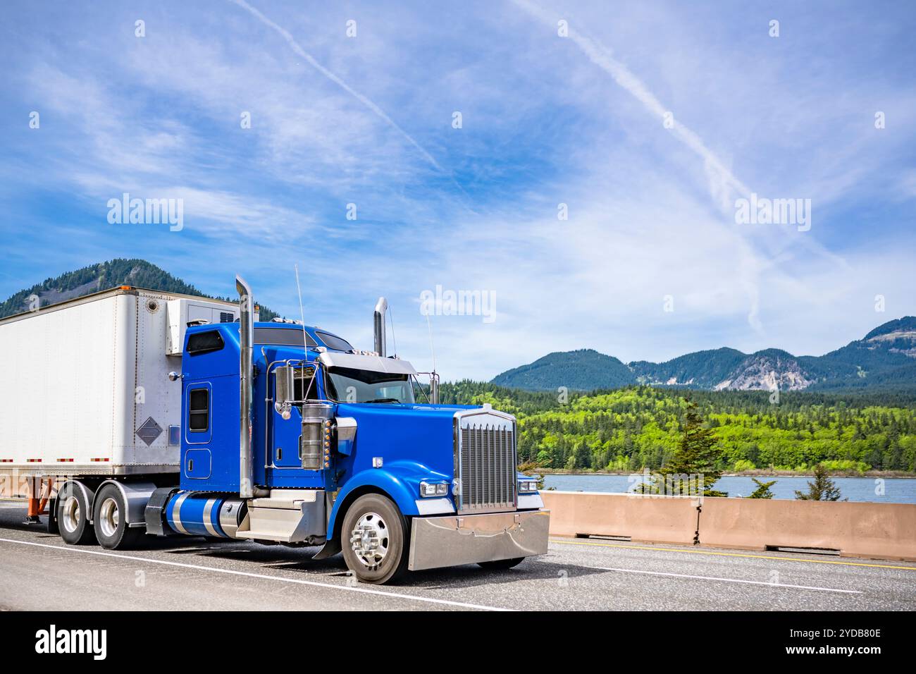 Industrial long hauler blue big rig semi truck tractor with extended cab for truck driver rest ...