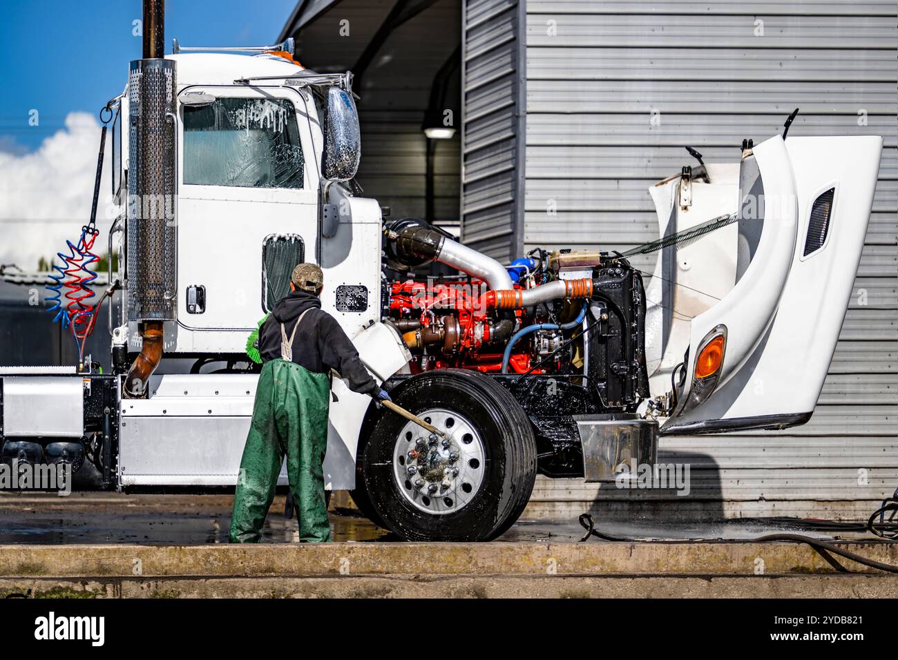 Professional washer wash white day cab big rig semi truck tractor with ...