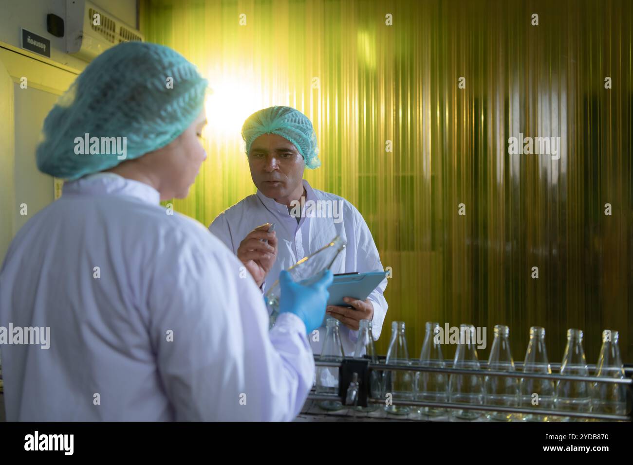 Product quality control officer in fruit juice production line Carry ...