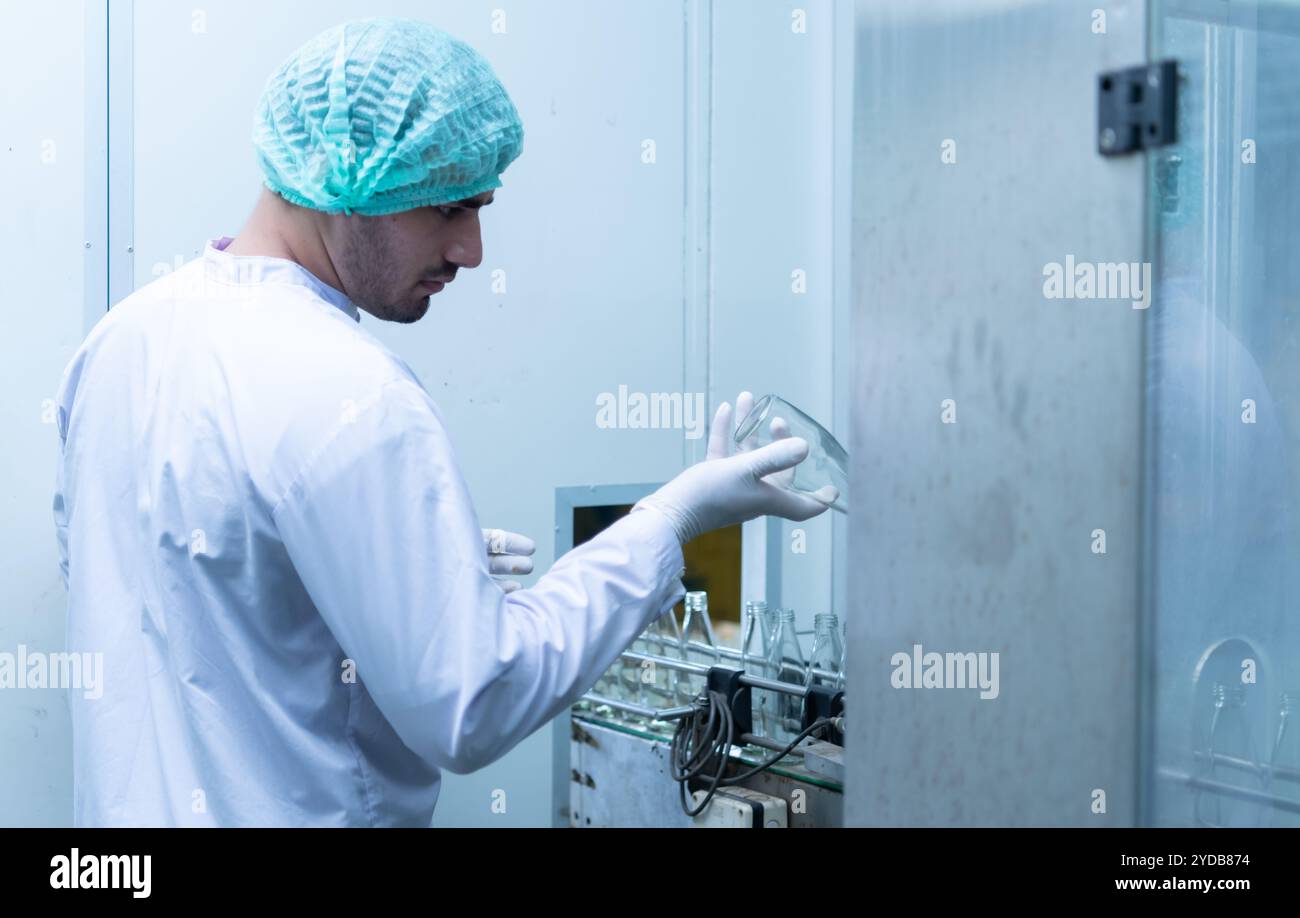 Product quality control officer in fruit juice production line Carry ...