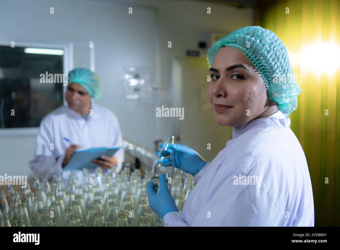 Product quality control officer in fruit juice production line Carry ...