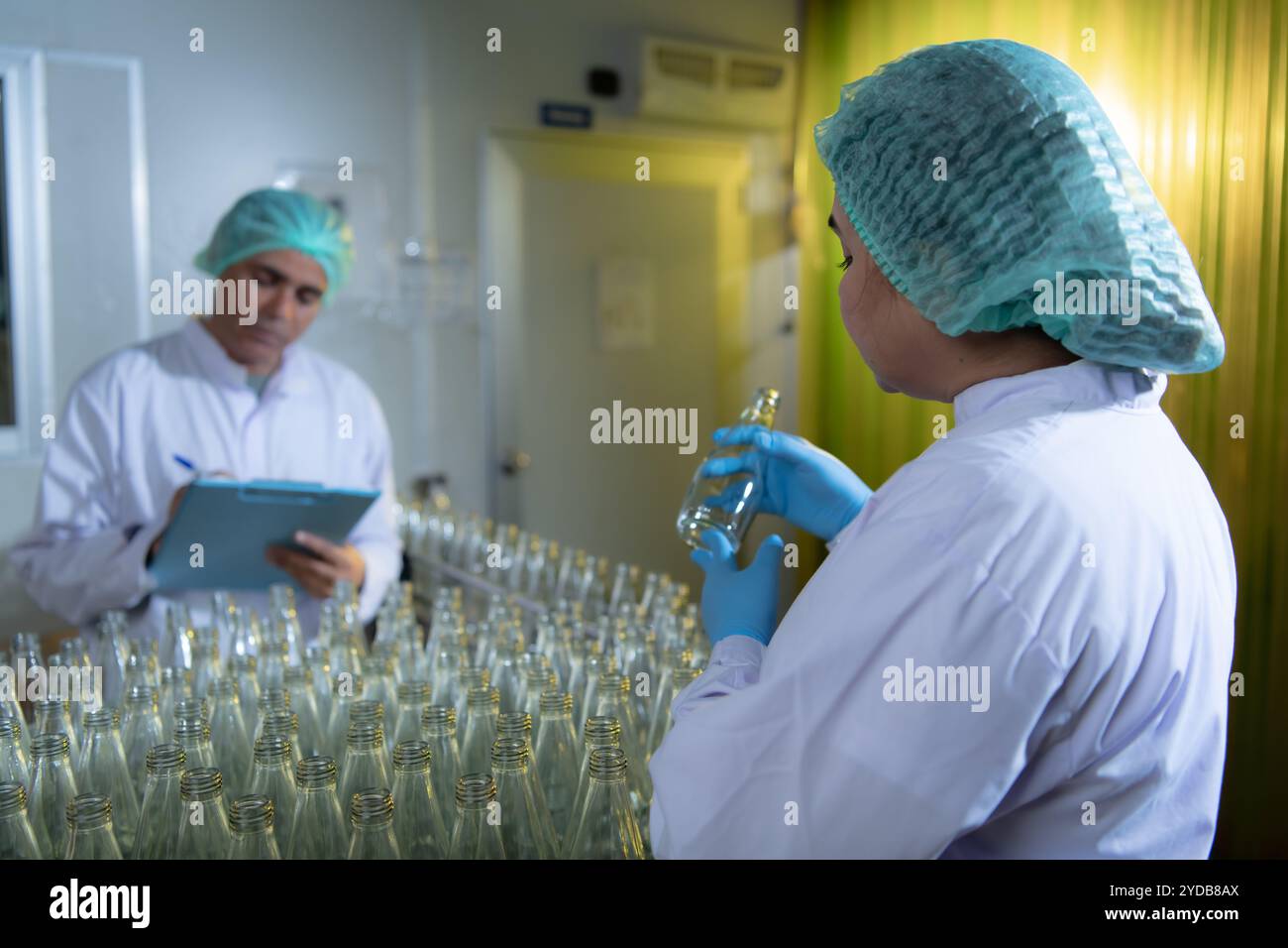 Product quality control officer in fruit juice production line Carry ...