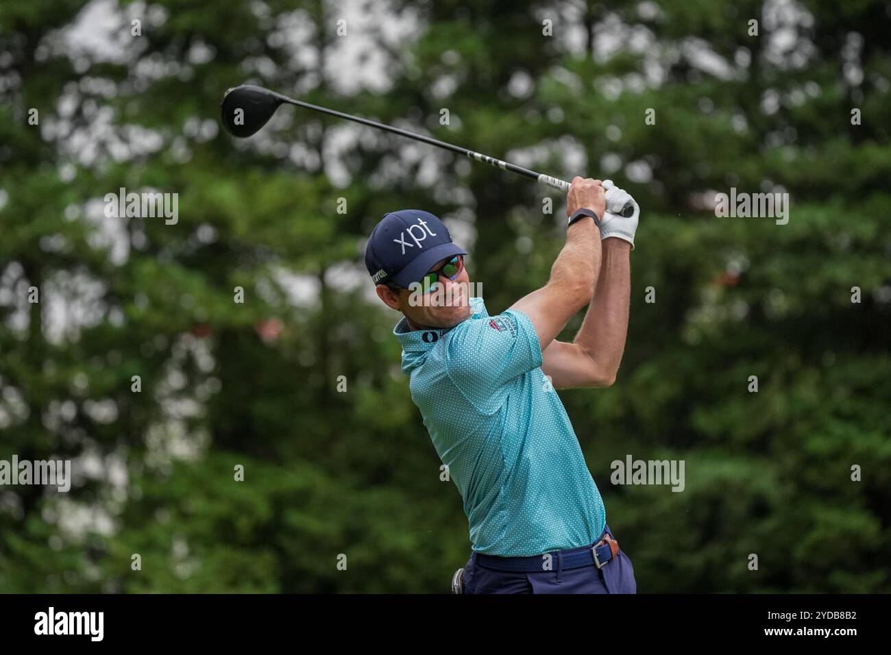 Adam Schenk of the United States hits his tee shot on the fourth hole ...