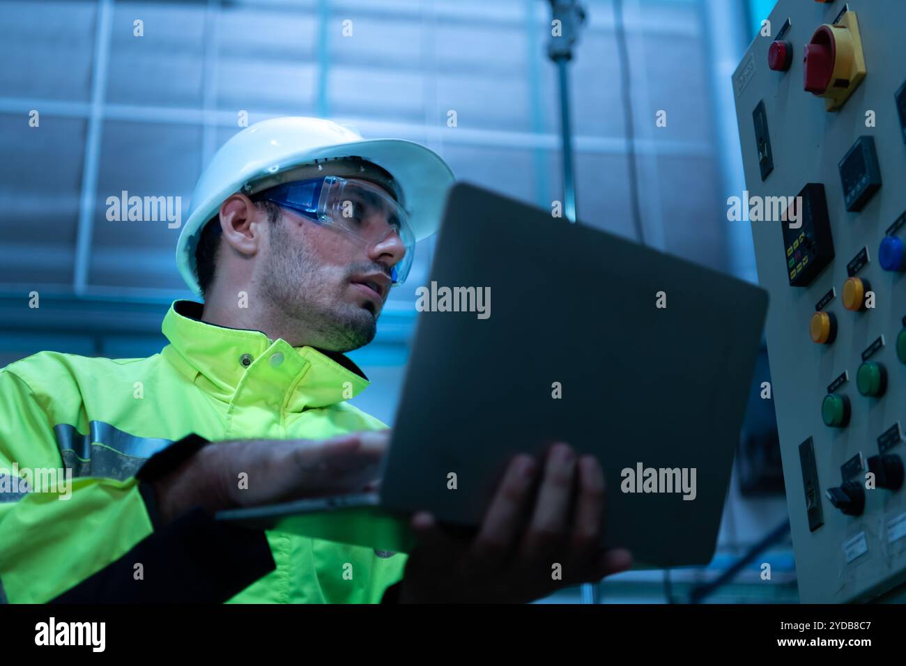 Chief Engineer of Mechanical Plant Checking the electronic circuit of ...