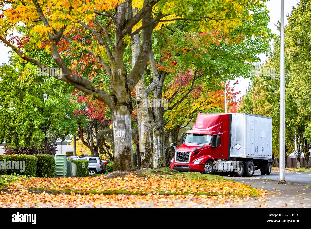 Industrial day cab red big rig semi truck with roof spoiler ...