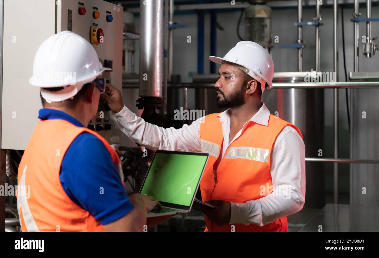 Engineer of a mechanical plant Inspecting and explaining the ...