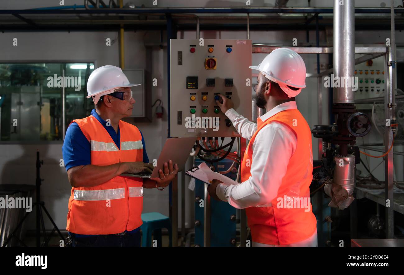 Engineer of a mechanical plant Inspecting and explaining the ...