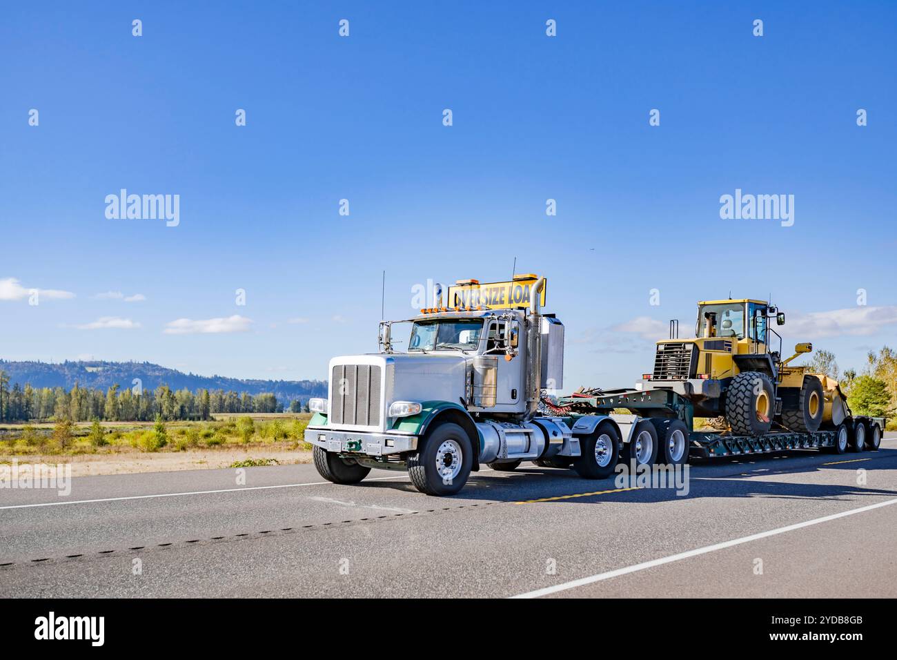 Industrial powerful white day cab big rig semi truck with oversize load ...