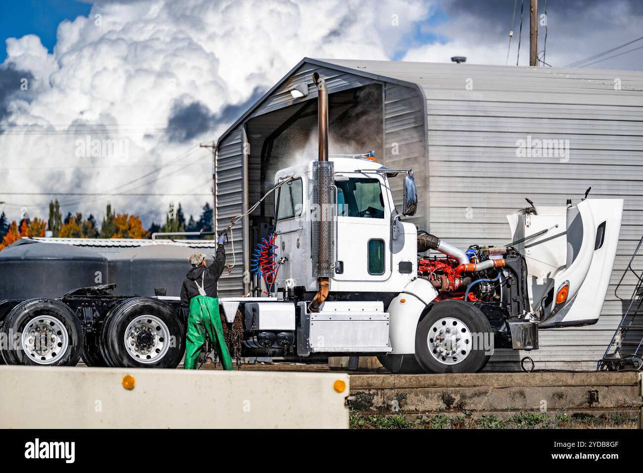 Professional washer wash white day cab big rig semi truck tractor with ...
