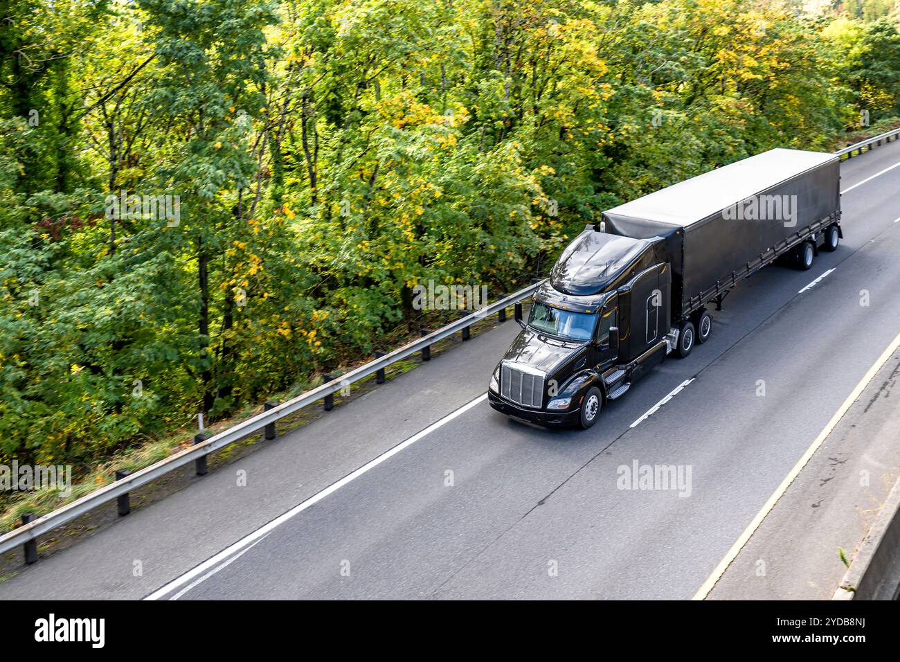 Industrial long hauler black big rig semi truck tractor with extended ...