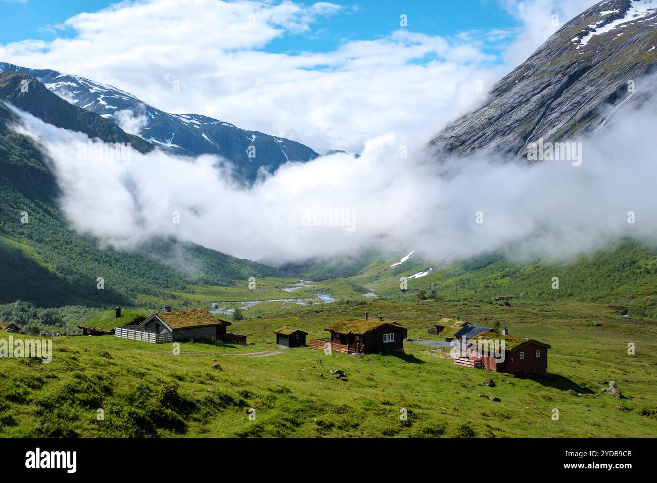 Norwegian Valley Cabins Amidst Clouds Stock Photo - Alamy
