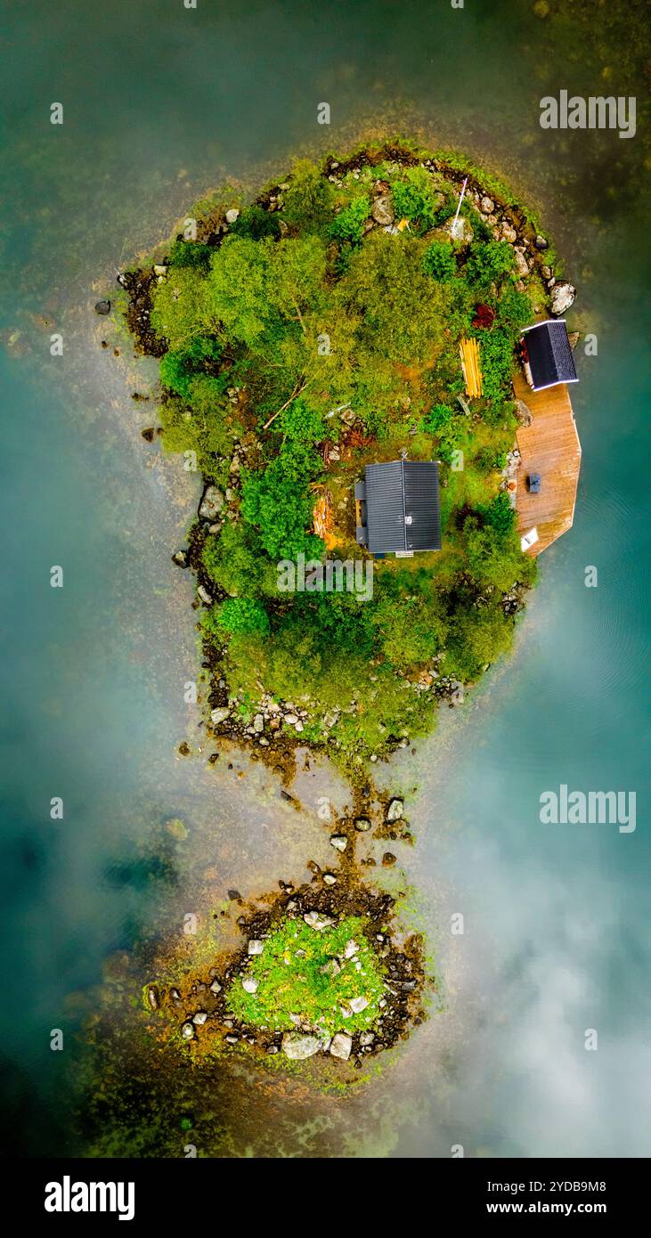 A Tiny Island Home in Misty Norway, Lovrafjorden, Norway Stock Photo ...