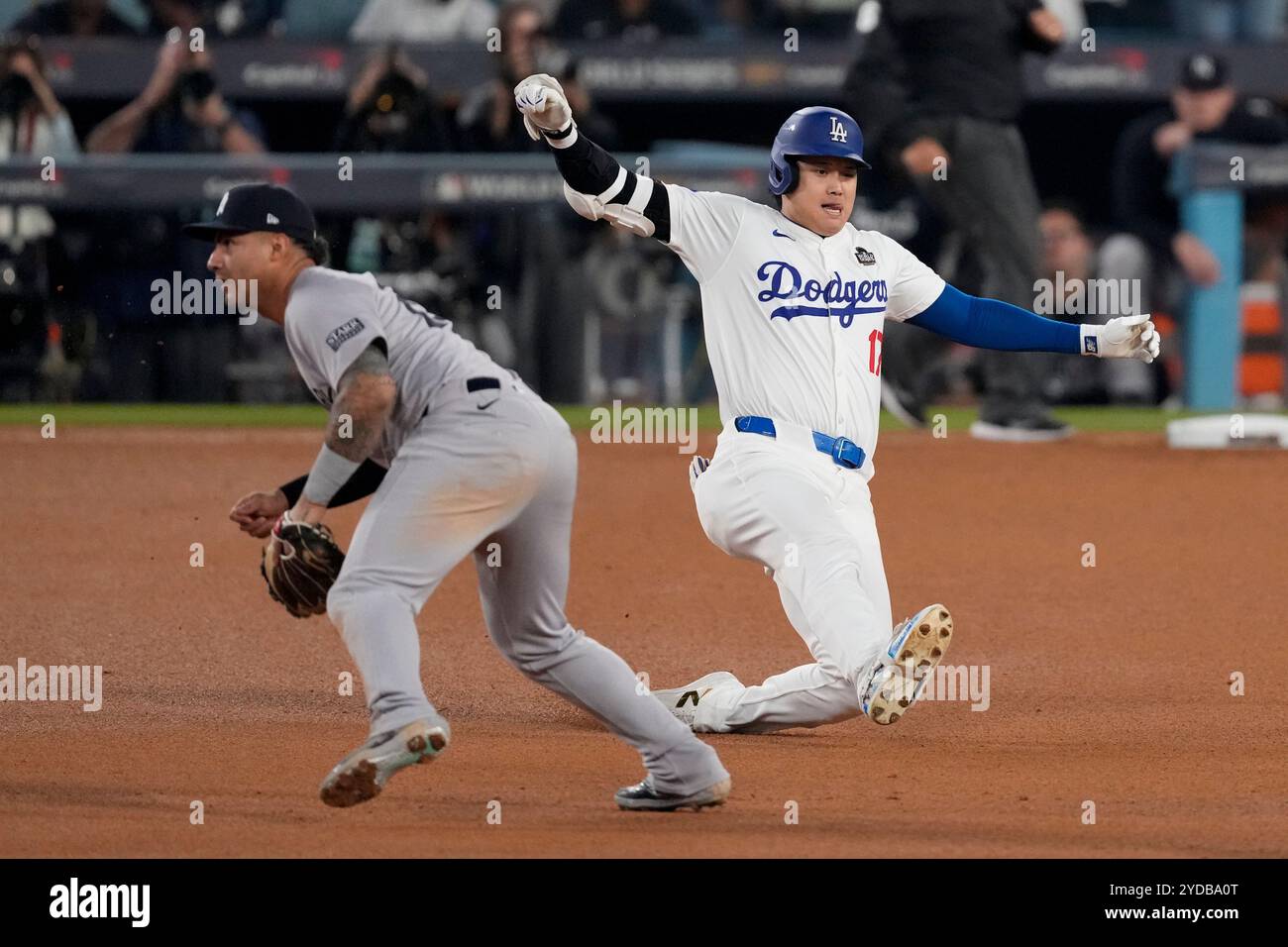 Los Angeles Dodgers' Shohei Ohtani slides into second base for a double ...
