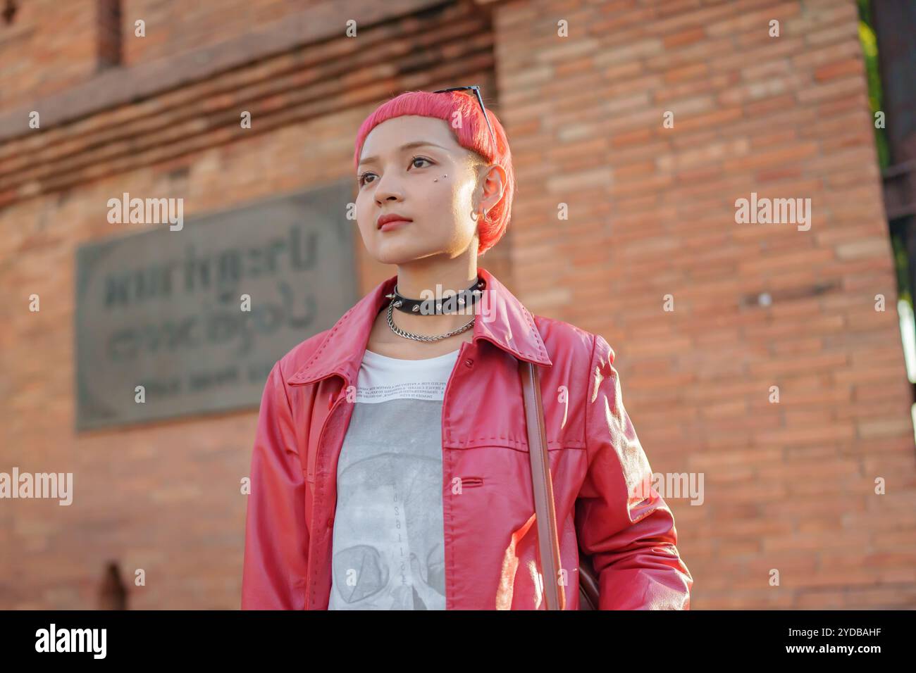 Gen z girl leather fashion with punk Asian woman tourist of local city ...