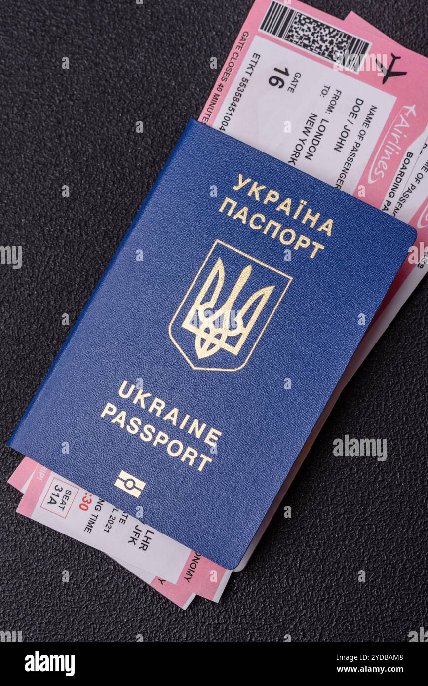 Biometric Ukrainian passport, flight tickets and money Stock Photo - Alamy