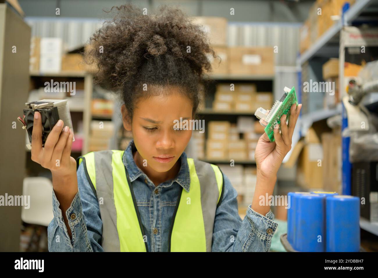 Female warehouse worker Counting items in an industrial warehouse on ...