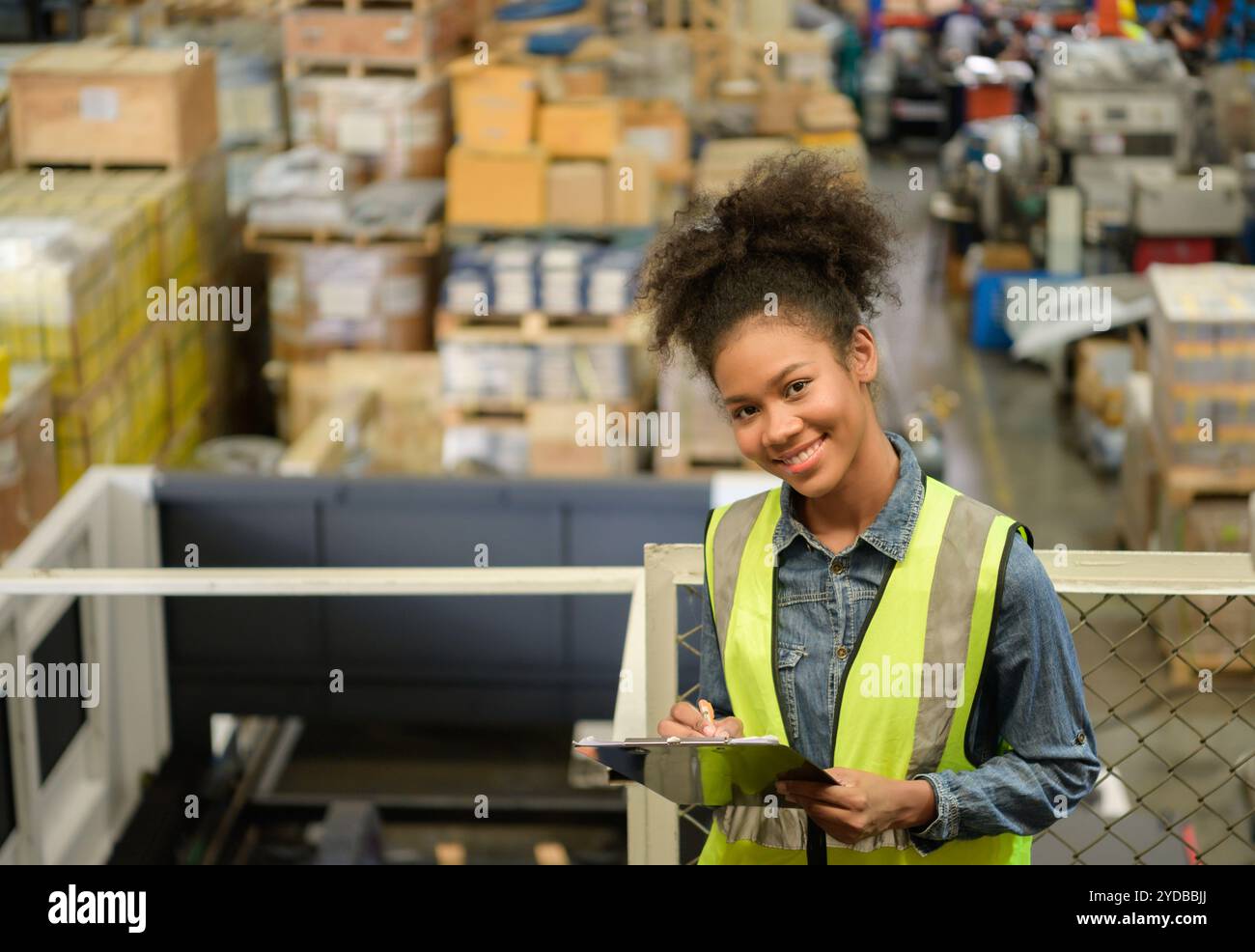 Female warehouse worker Counting items in an industrial warehouse on ...