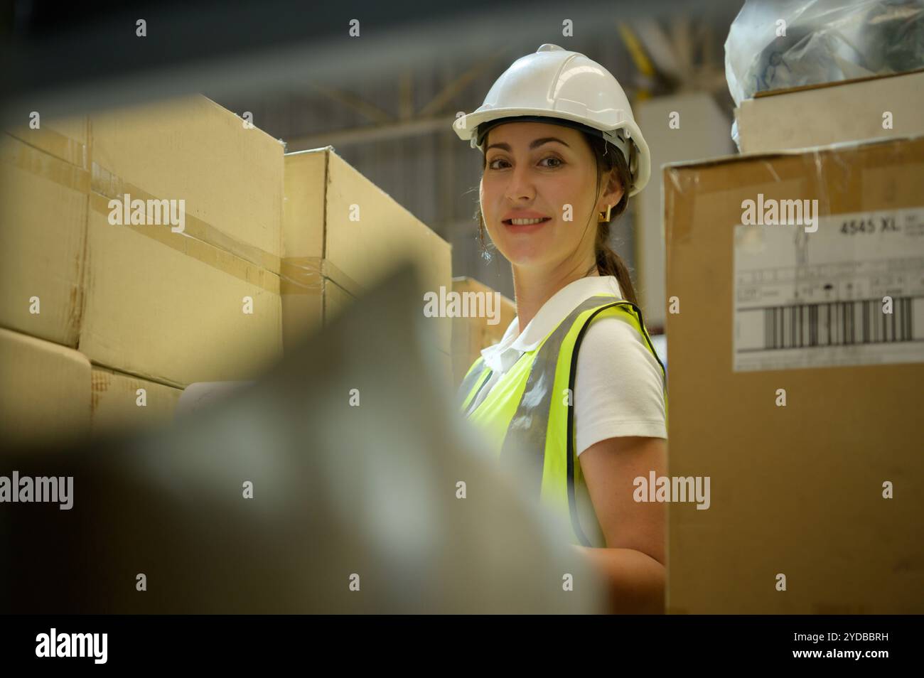 Female warehouse worker Counting items in an industrial warehouse on ...