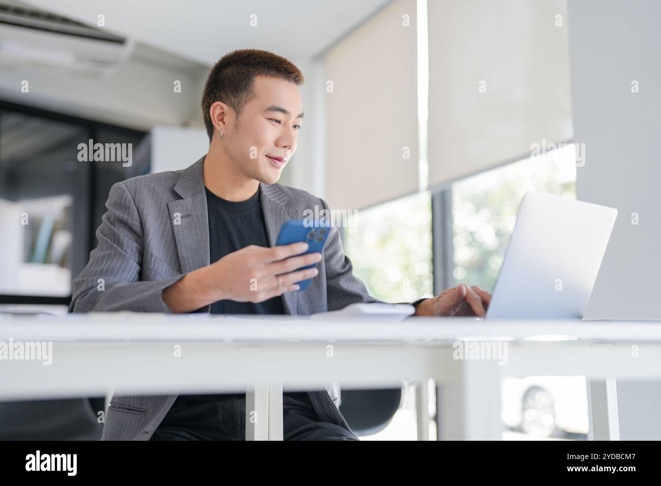 Asian Business man working with laptop. Young business man thinking ...
