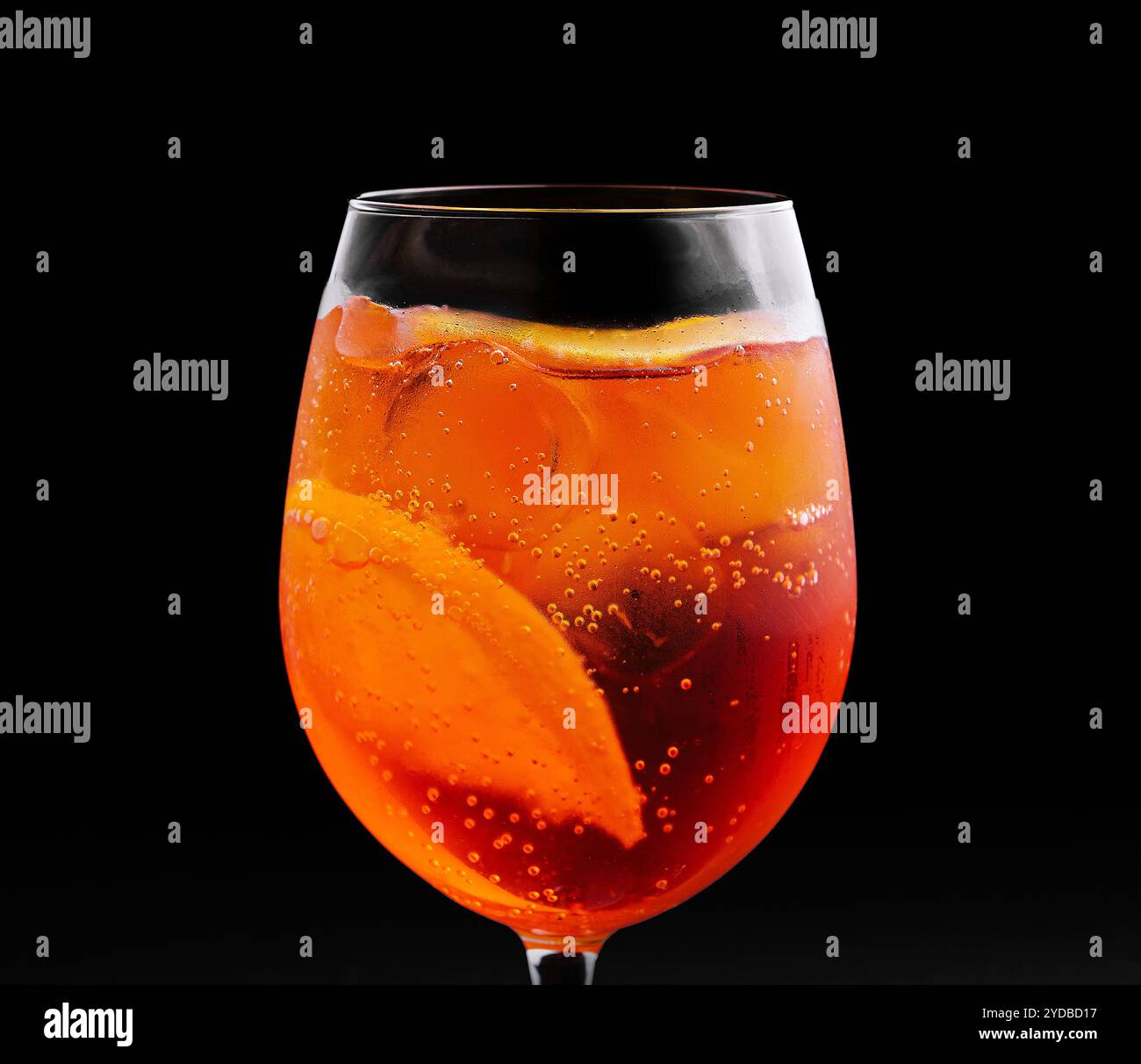 Glass of aperol spritz cocktail on black background Stock Photo - Alamy