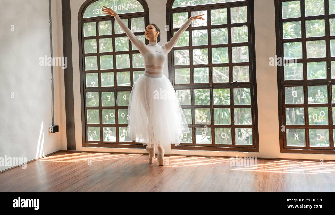 Asian girlÂ ballet dancer creative performance with white skirt ...
