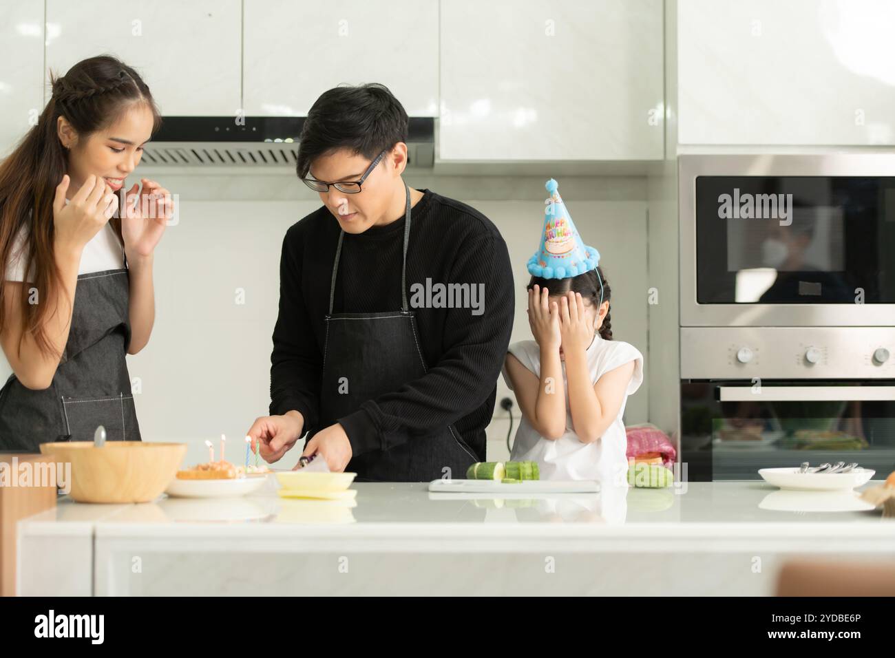 New generation asian family cook together and organize a small birthday ...