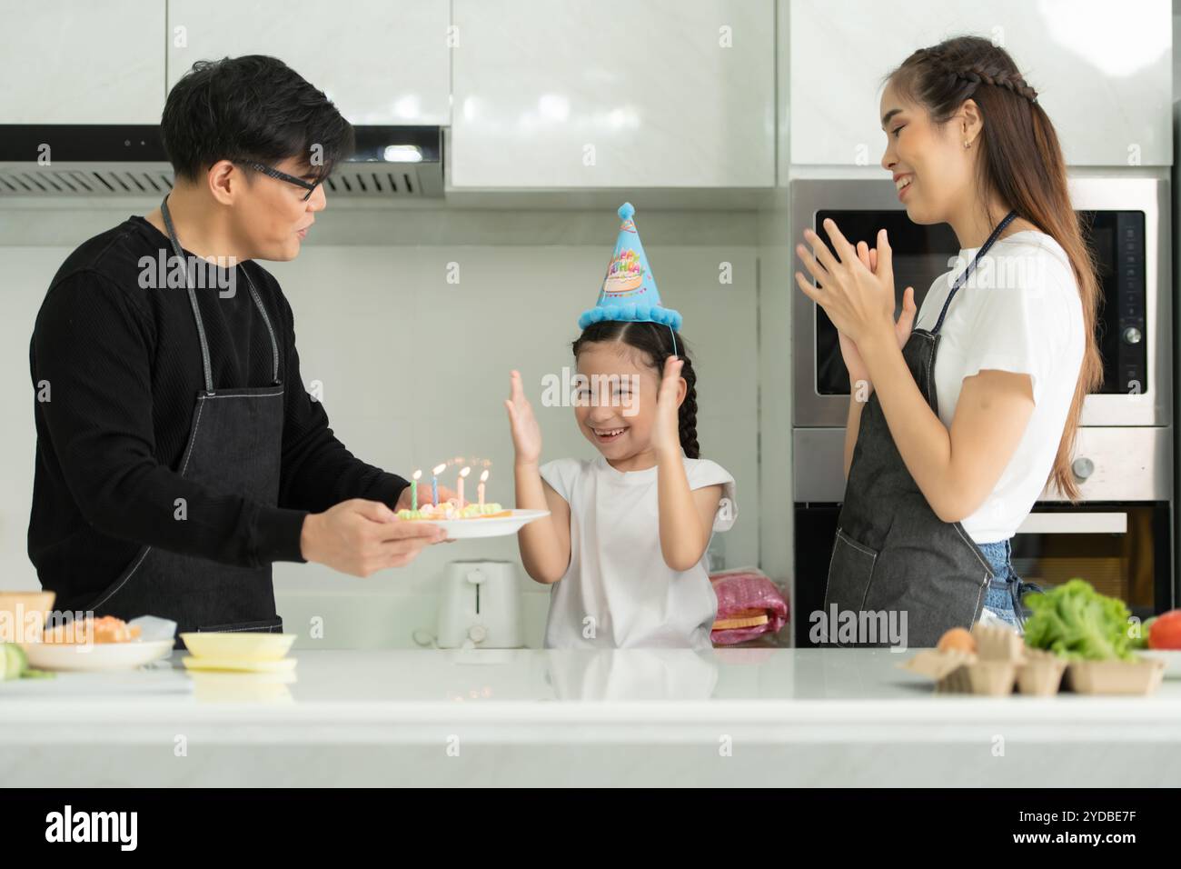 New generation asian family cook together and organize a small birthday ...