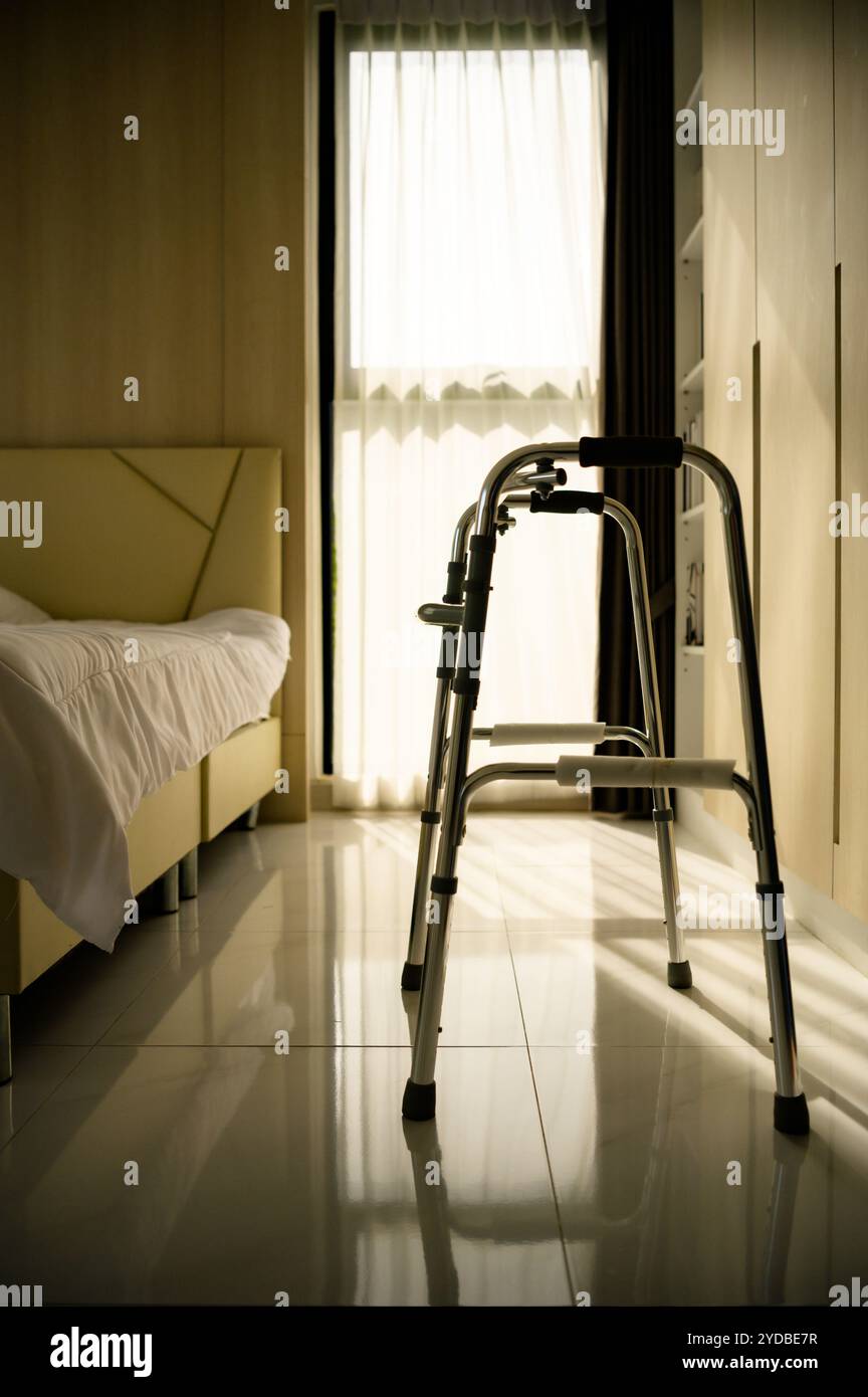 A bedroom showing the golden morning sun shining through the curtains ...