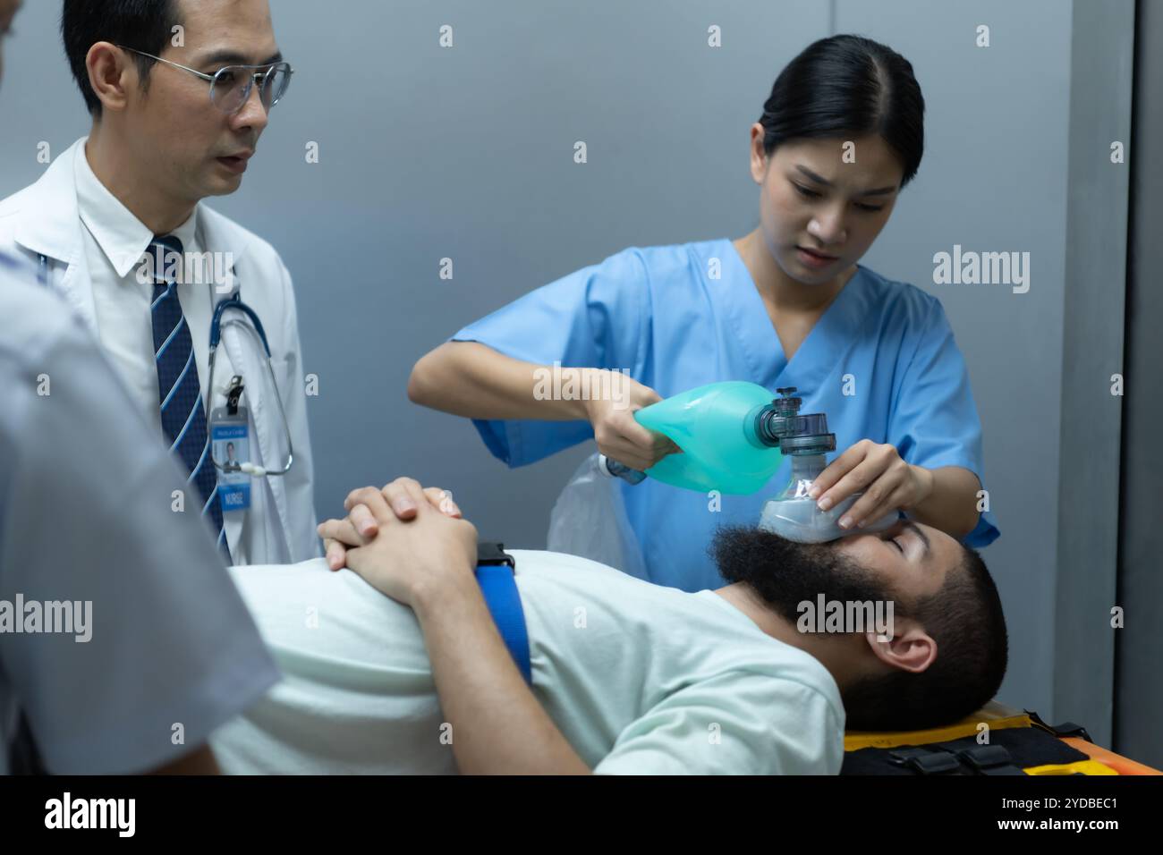 First aid assistance of the ambulance medical team Stock Photo - Alamy