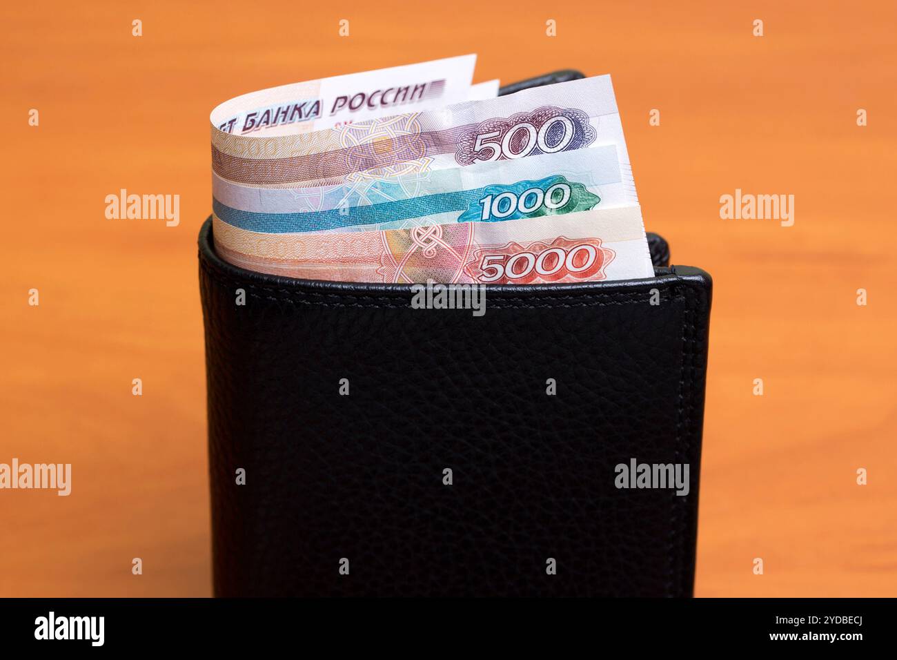 Russian ruble in the black wallet Stock Photo - Alamy