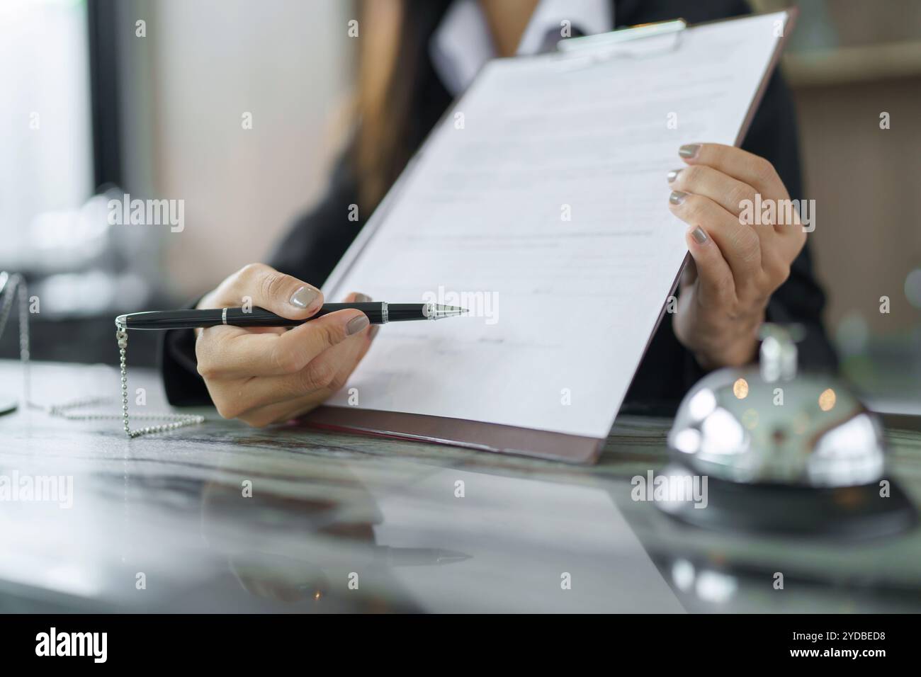 Hotel receptionist in uniforms at desk in lobby Friendly and welcome ...